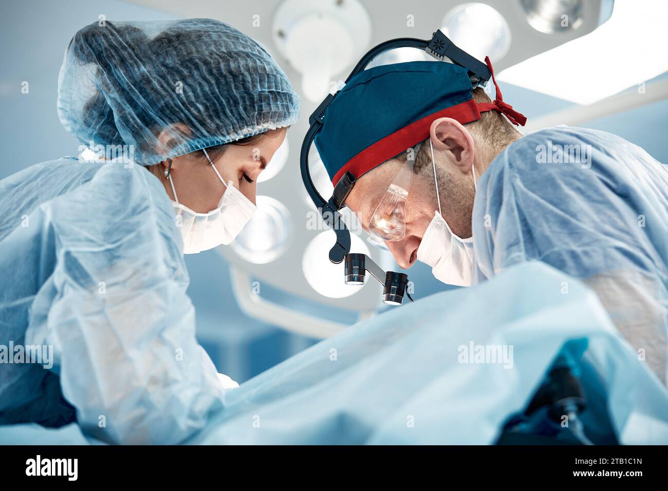 Close up of doctors and nurses in operating room, professional doctors ...