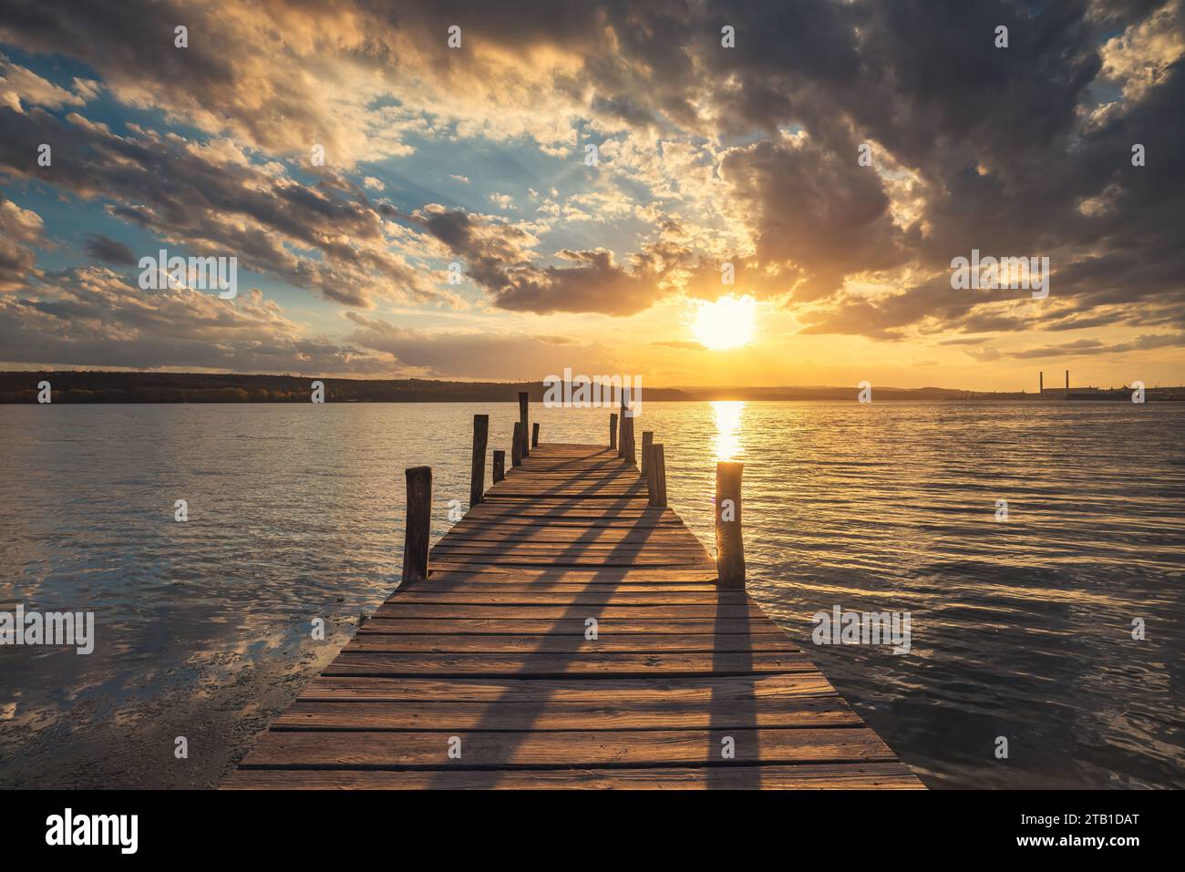Small Dock and sunset at the lake Stock Photo - Alamy