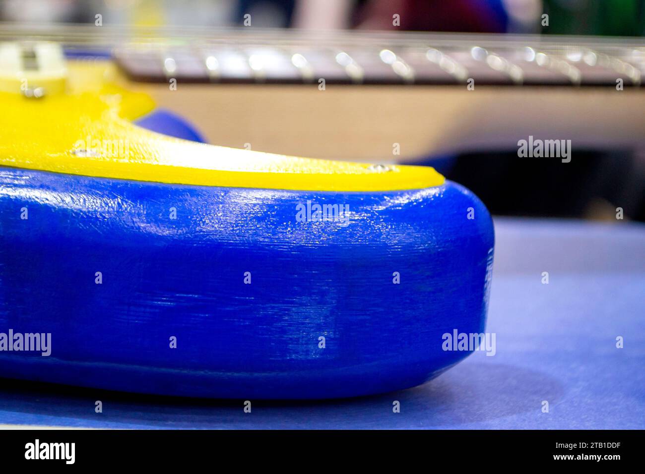 Musical instrument guitar 3D printed from molten plastic in yellow and ...