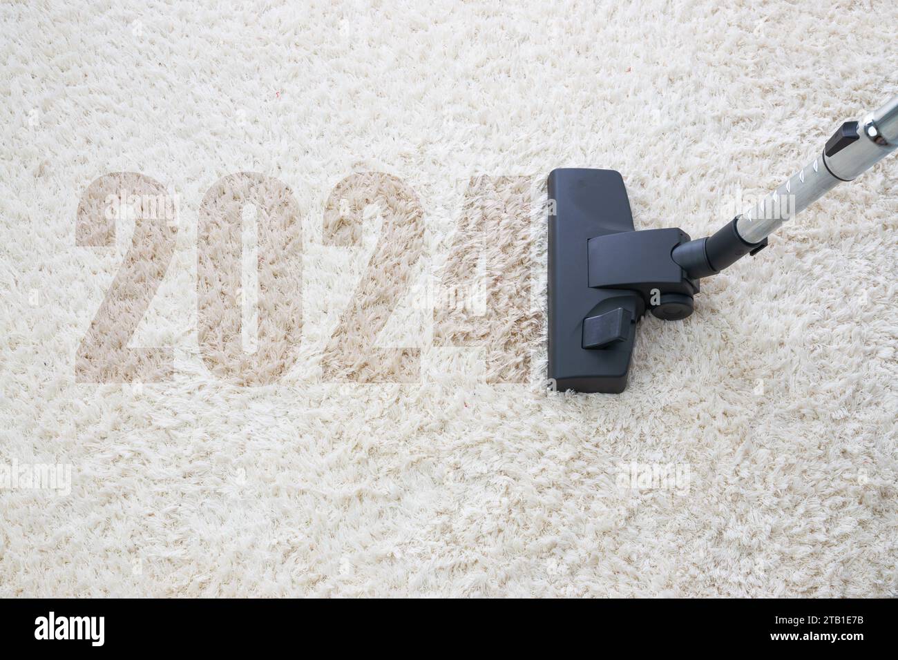 home cleaning with vacuum cleaner and copy space for a text, new year ...