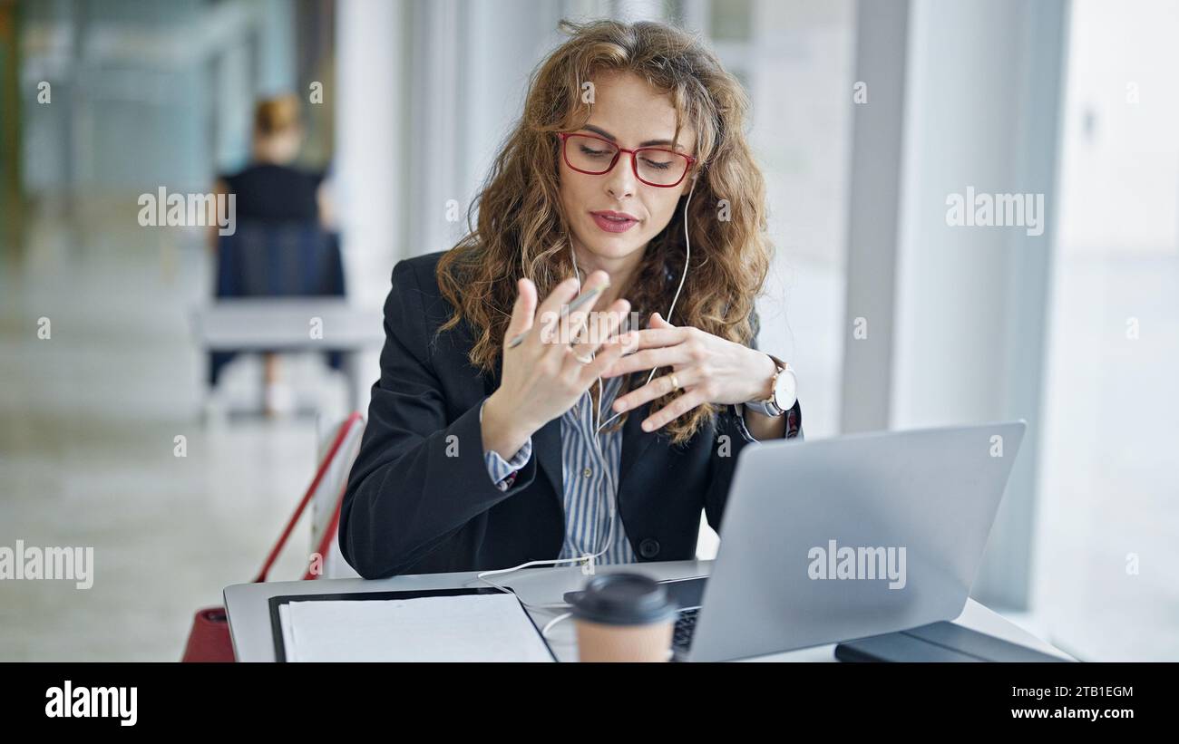 Young woman business worker having video call at the office Stock Photo ...