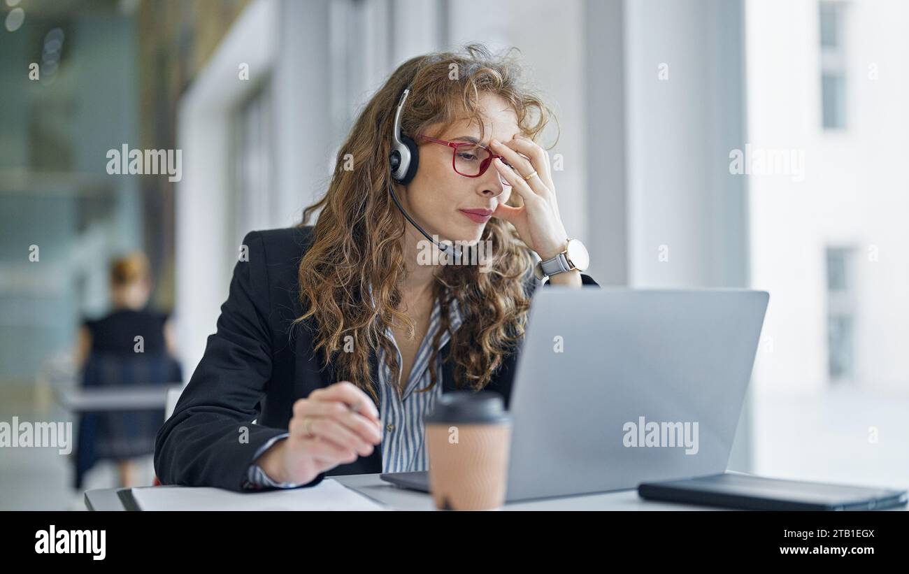 Young woman business worker having video call stressed at the office ...