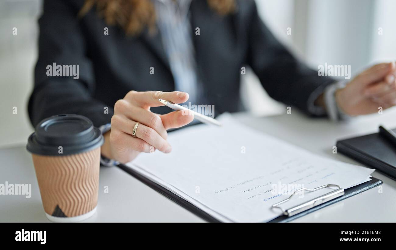 Young woman business worker writing on document at the office Stock ...