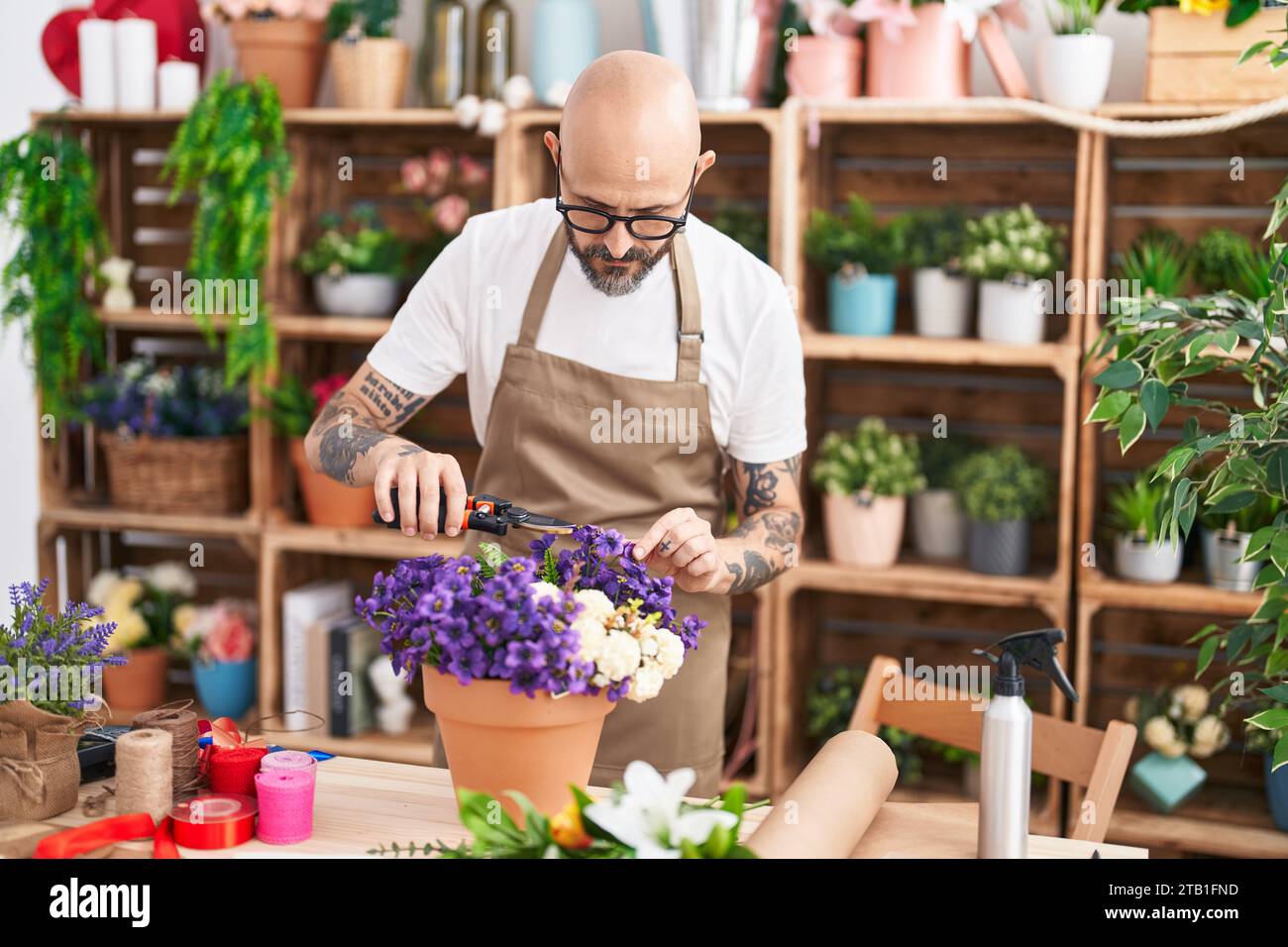 Young bald man florist hi-res stock photography and images - Alamy