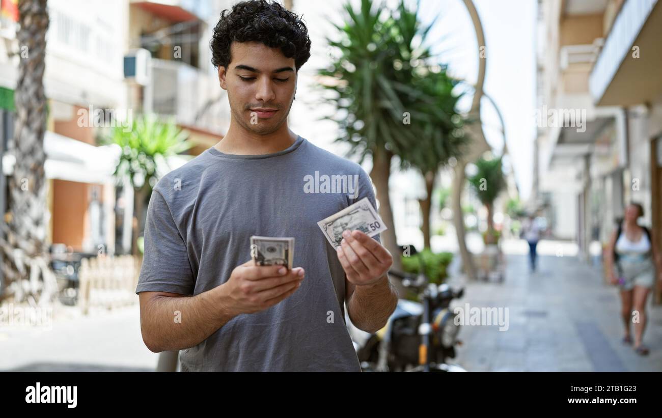 Portrait casual man counting dollars hi-res stock photography and ...