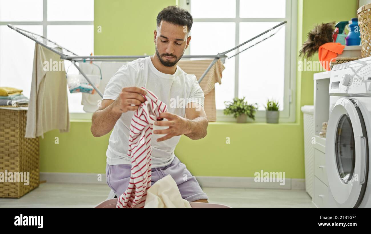 Folding clothes laundry male hi-res stock photography and images - Alamy