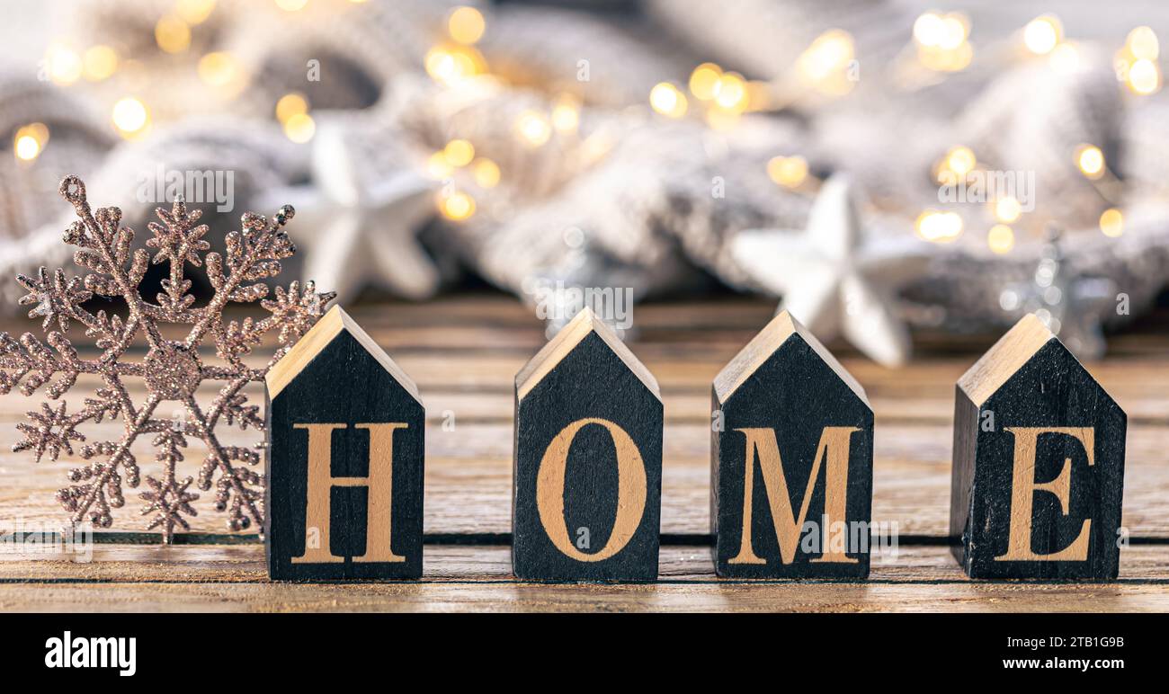 Cozy background with decorative word Home on a blurred background with ...