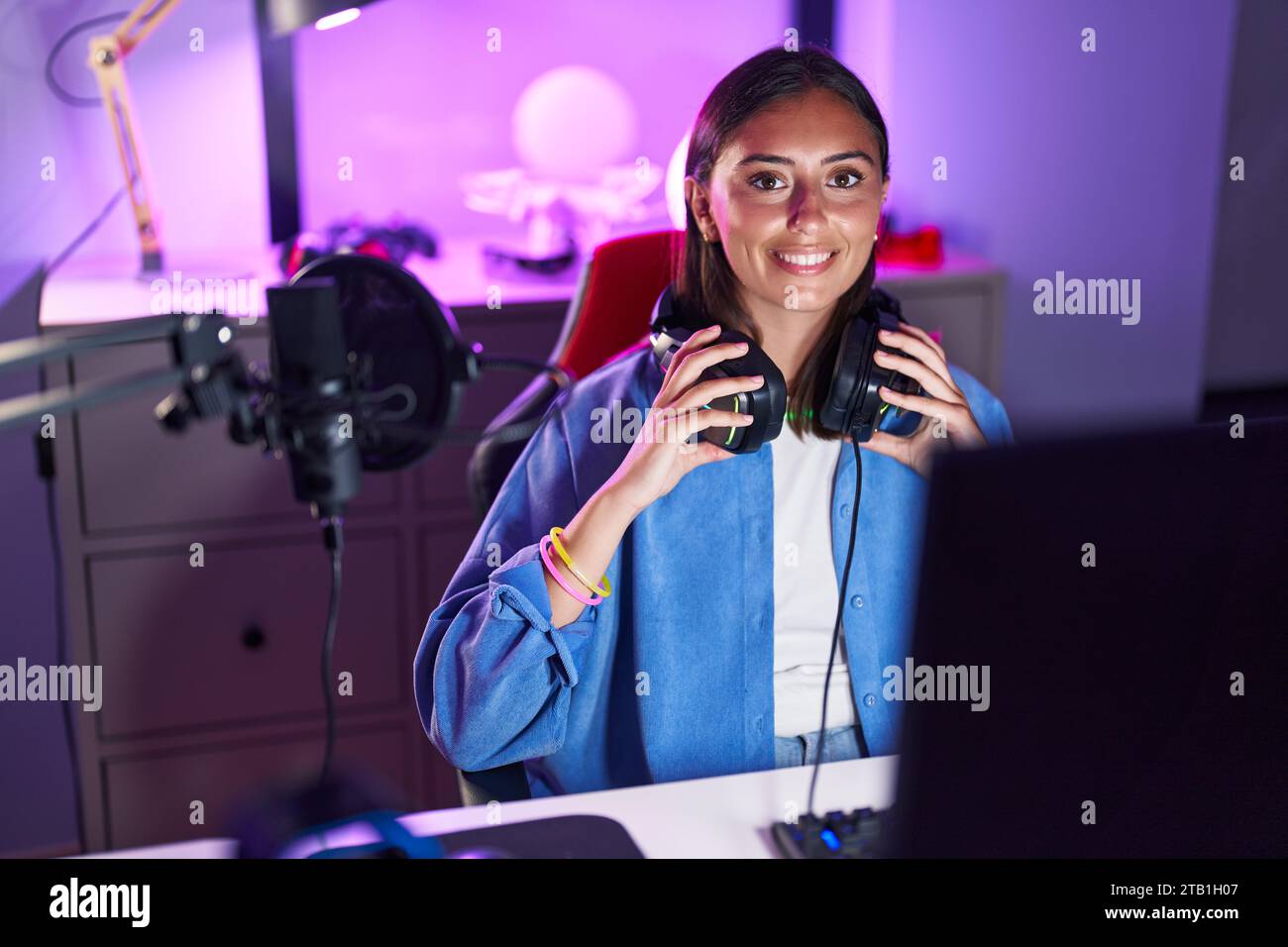 Young beautiful hispanic woman streamer smiling confident sitting on ...
