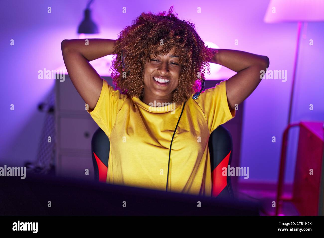 African american woman streamer smiling confident relaxed with hands on ...