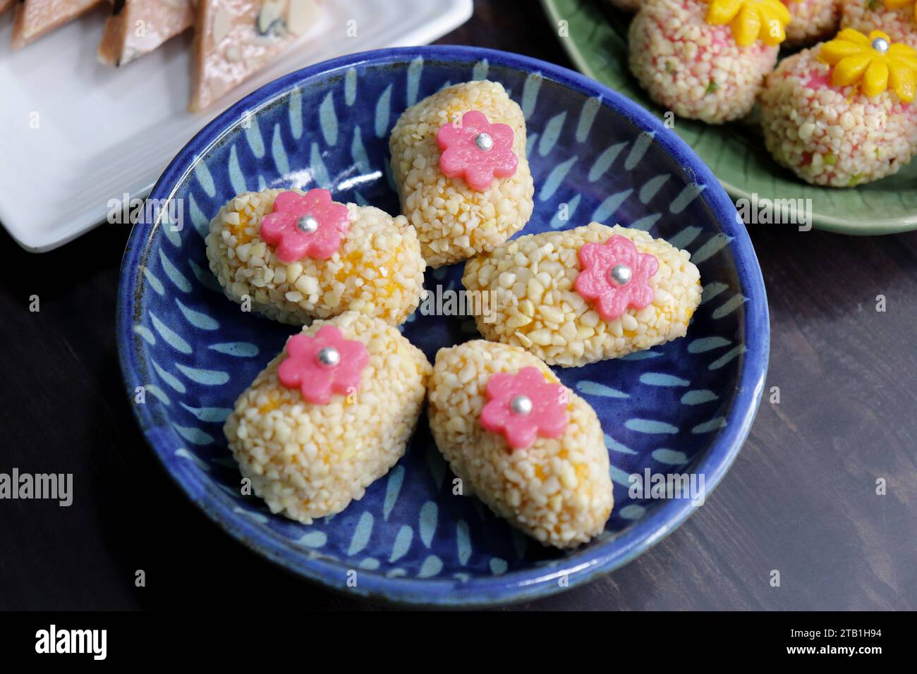 Indian assorted Diwali sweets or mithai with diya and flowers. Festive ...