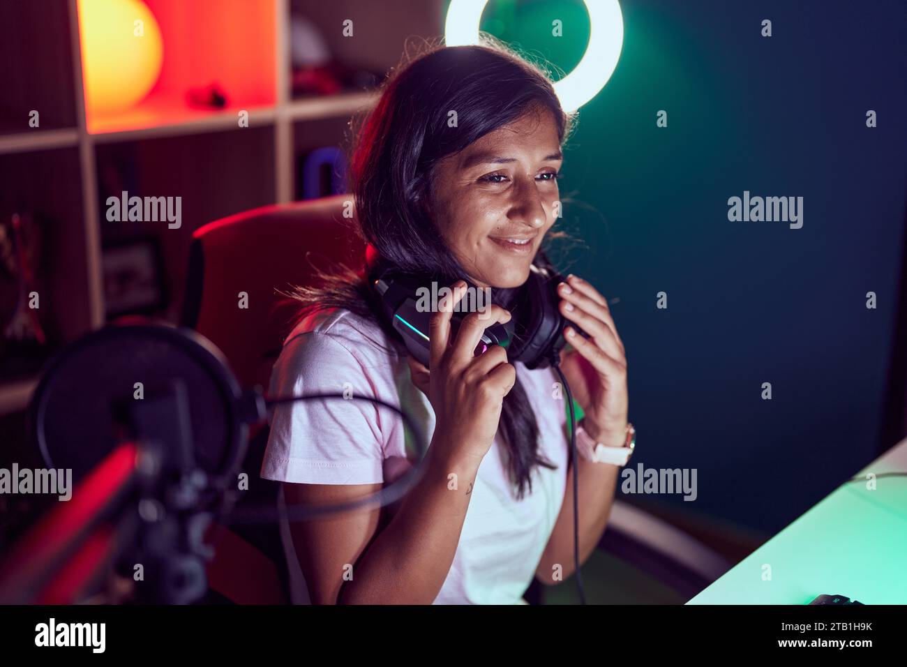 Young beautiful hispanic woman streamer smiling confident holding ...