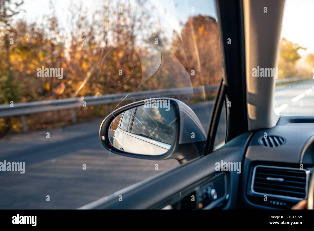 The view of the road in the car's rearview mirror Stock Photo - Alamy
