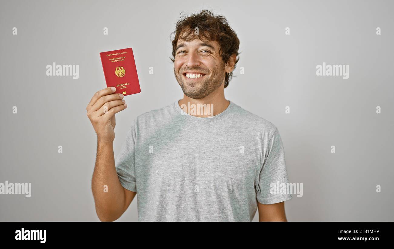 Happy young hispanic man, confidently smiling with joy, casually holds ...