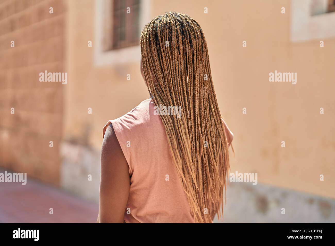 Back view woman braids walking hi-res stock photography and images - Alamy