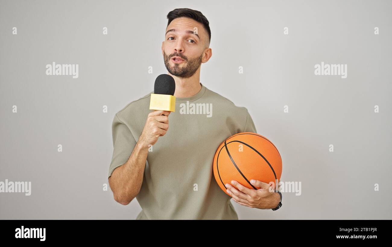 Young hispanic man basketball reporter working using microphone over ...