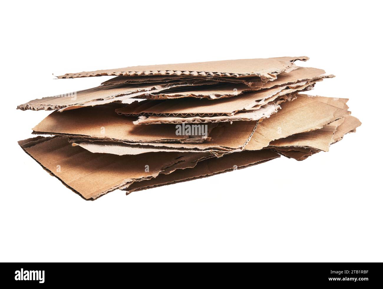 Stack of ripped pieces of cardboard material over isolated white ...