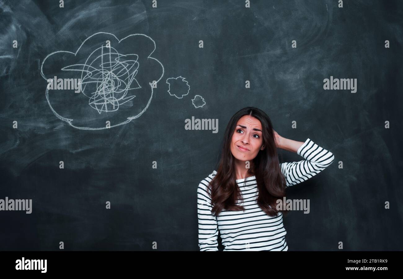 Close up portrait of confused young emotional teacher woman thinking ...