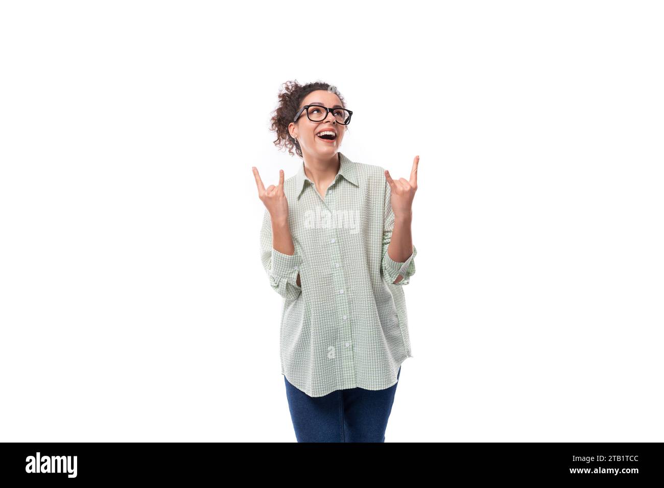 young successful teacher woman with curly black hair in shirt and jeans ...
