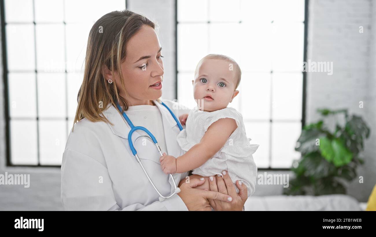 Doctor comforting baby hi-res stock photography and images - Alamy