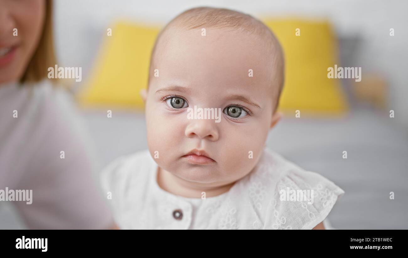 Casual indoor lifestyle of a lovely mother and daughter, together ...