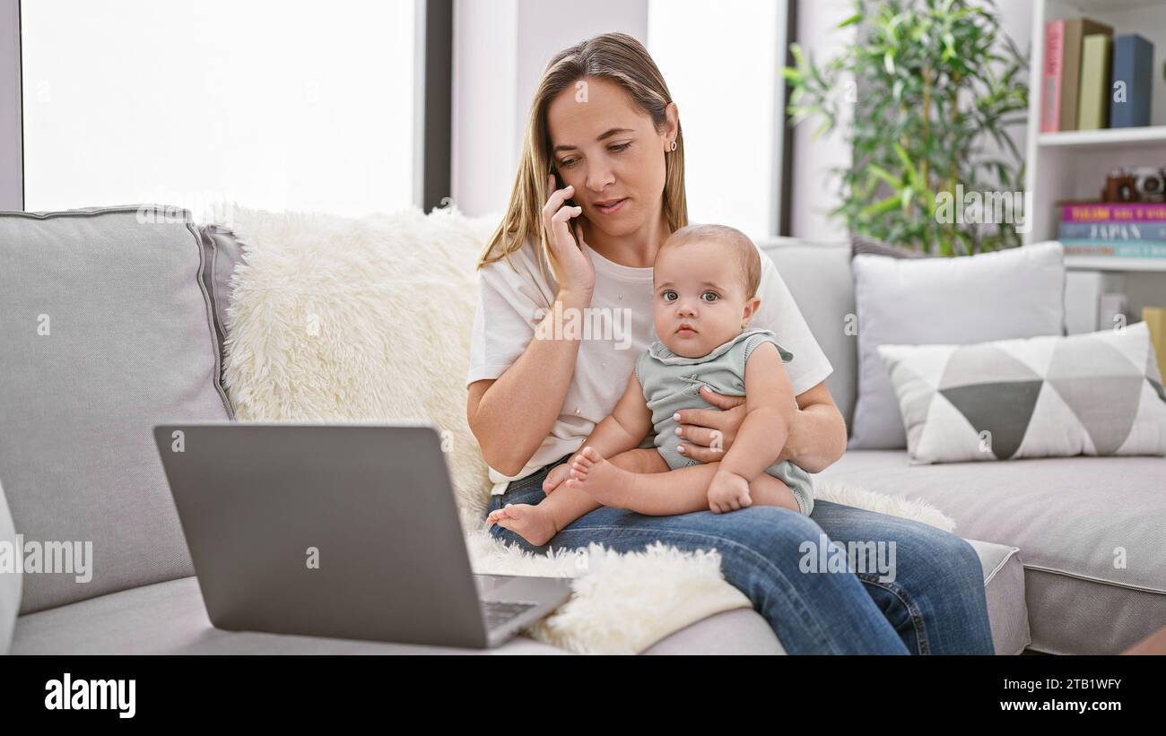 Mother and daughter's casual bonding session, sitting on the sofa ...