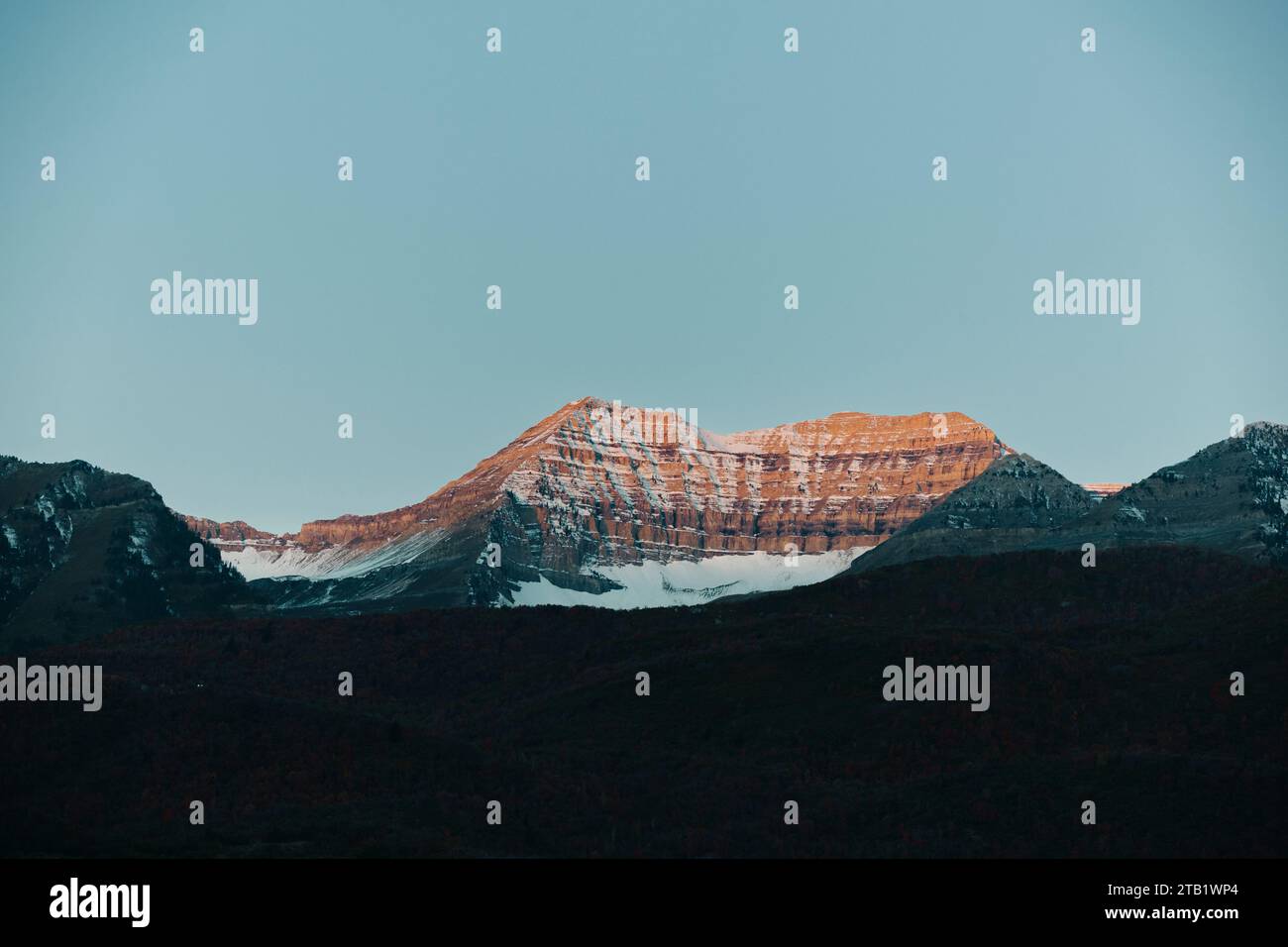 Sunlight illuminates mountain range from hi-res stock photography and ...