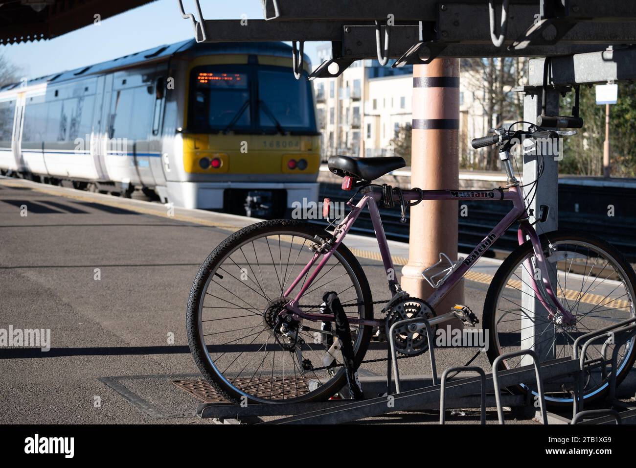 Parked bicycle and Chiltern Railways train, Leamington Spa station, UK ...