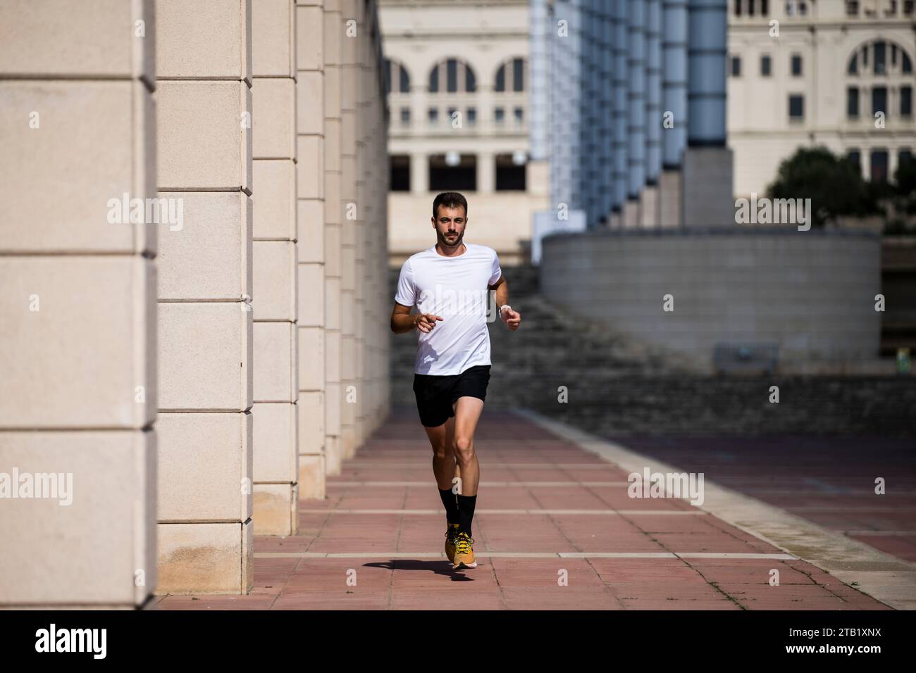 Athletic man running hi-res stock photography and images - Alamy