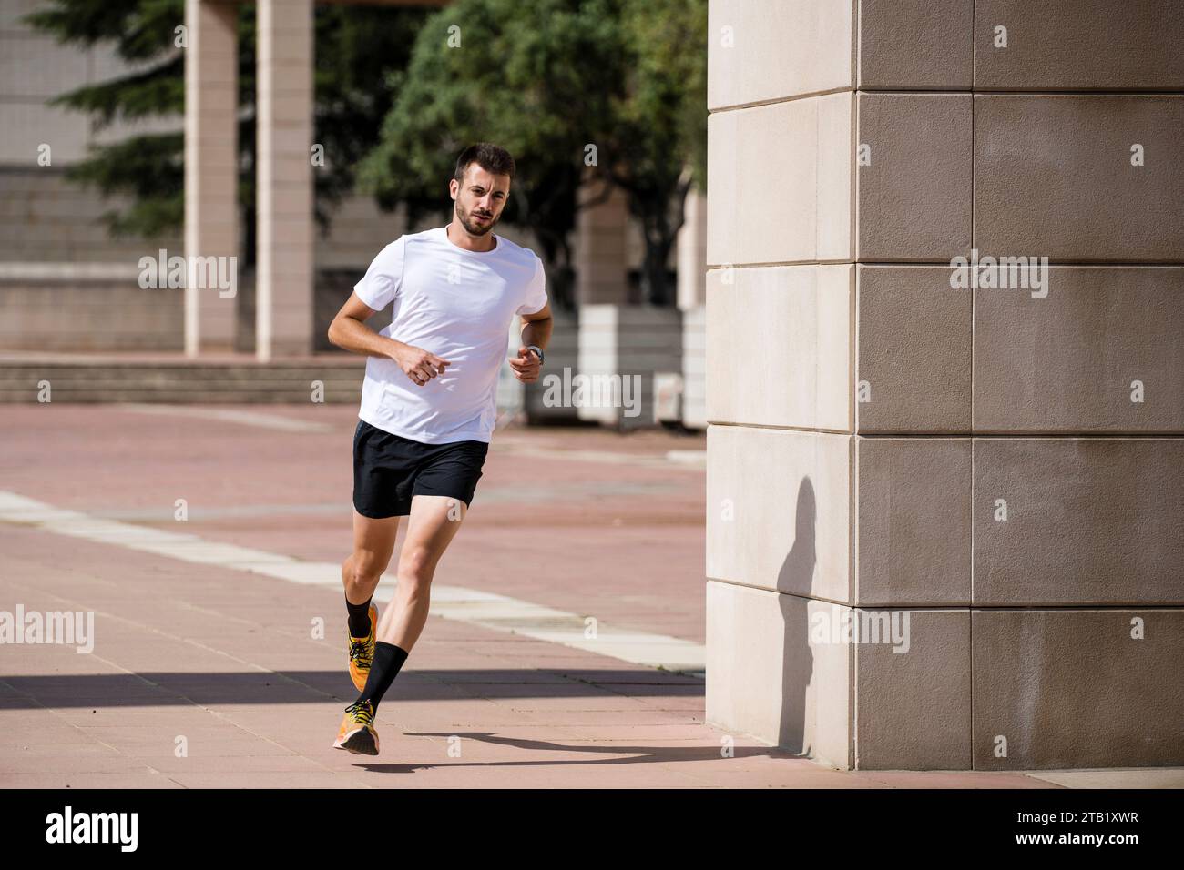 Fit runner man sprinting in the street Stock Photo - Alamy