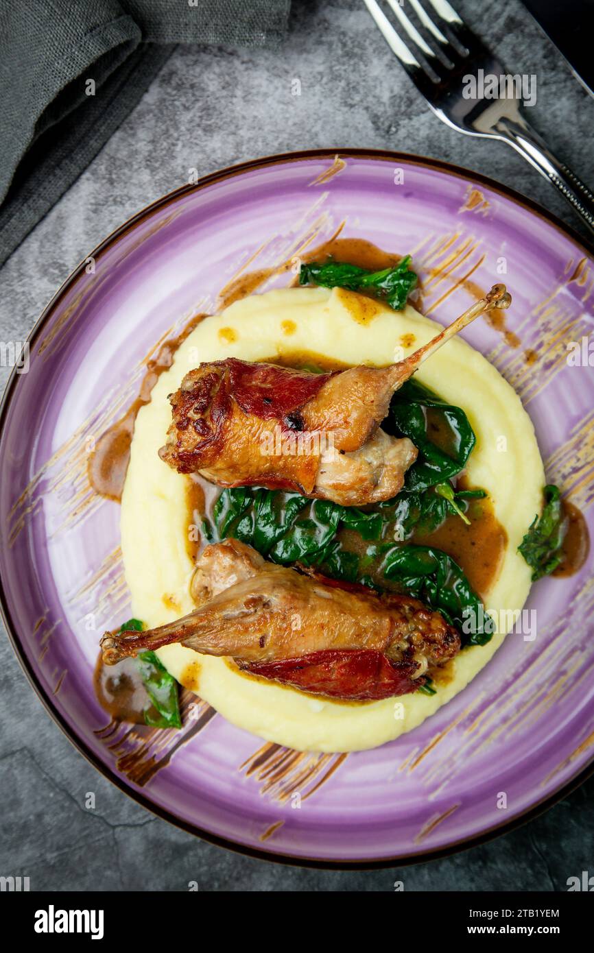 baked chicken wings with gravy, spinach and mashed potatoes top view ...