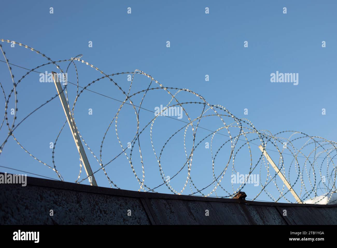 Barbed wire. Dangerous fence. Protected fence Stock Photo - Alamy