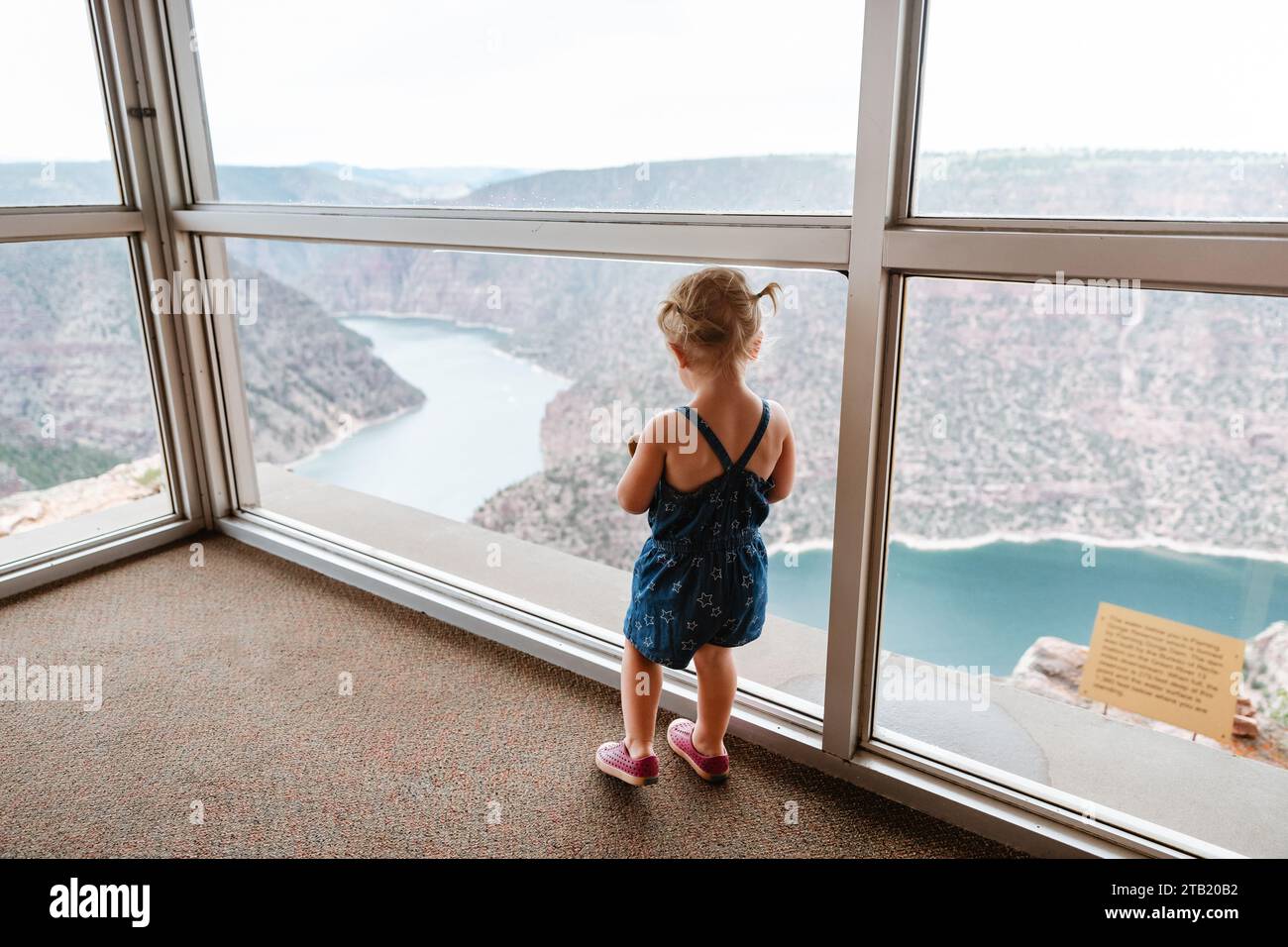 Tourist looking through windows in Red Canyon Visitor Center at Stock ...