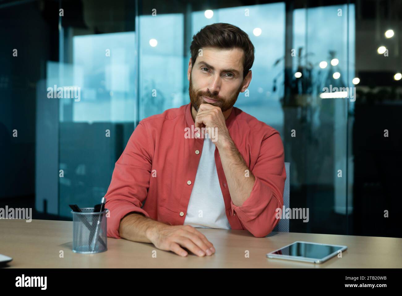 Upset unhappy and sad man inside office at workplace talking with ...