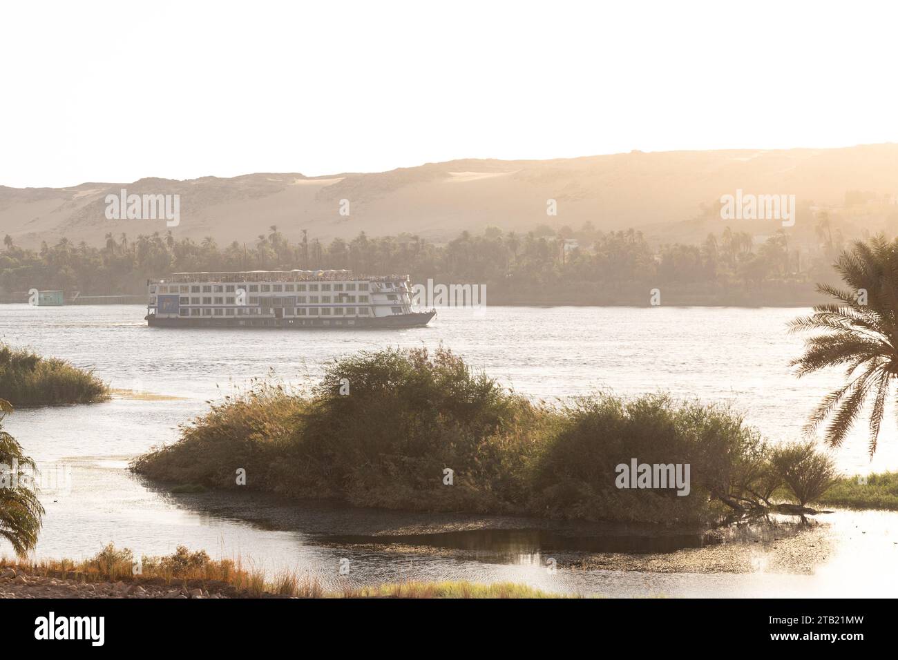 Cruise sailing the nile river during golden sunset, Aswan Stock Photo ...