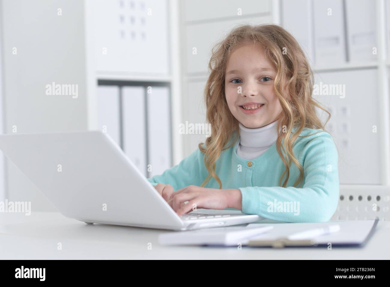 Cute and happy little girl children using laptop computer Stock Photo ...
