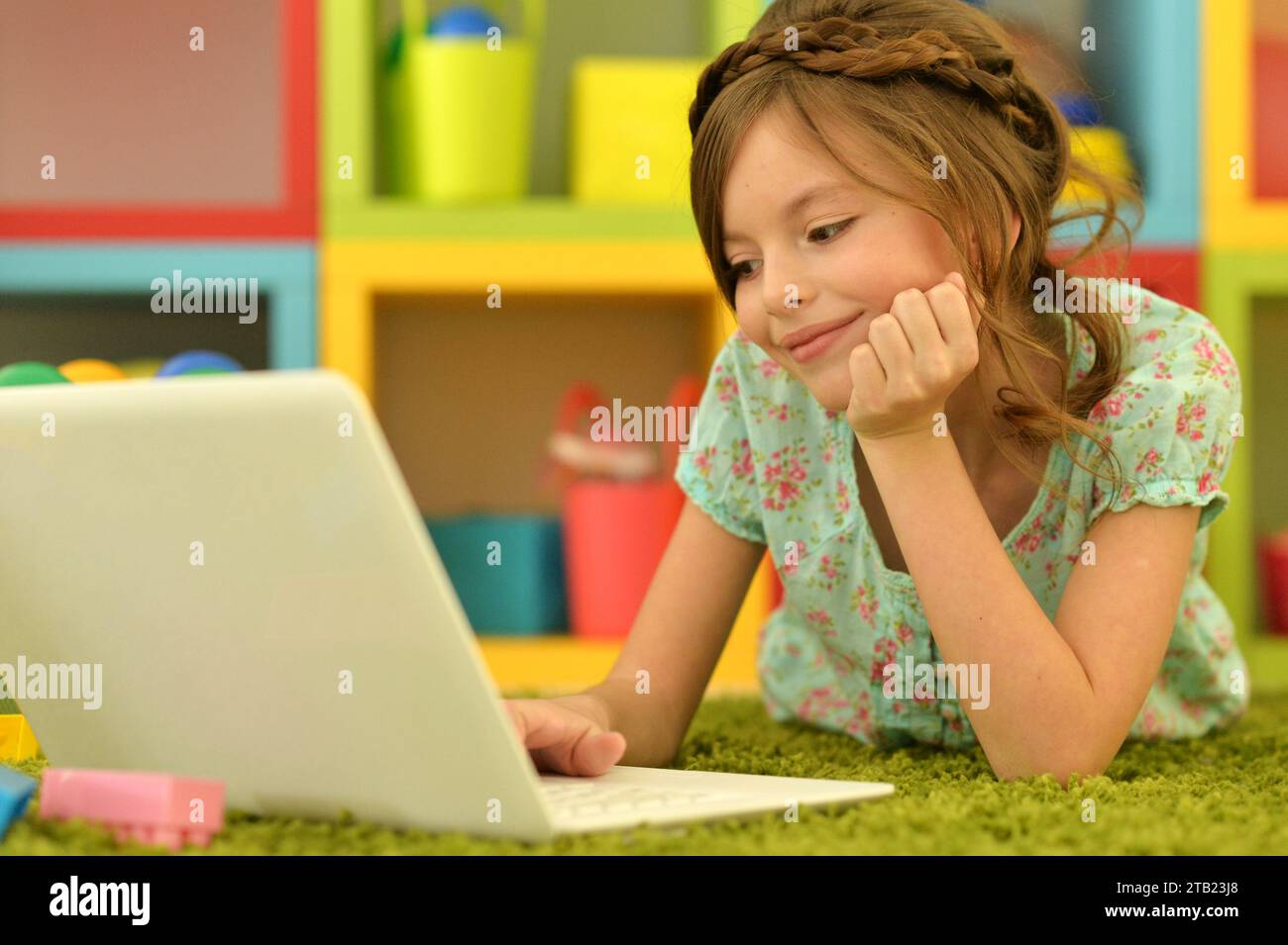Cute and happy little girl children using laptop computer Stock Photo ...