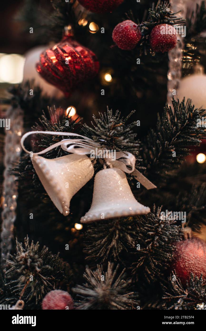 White magic bells with ribbon hanging on a Christmas tree with magic ...