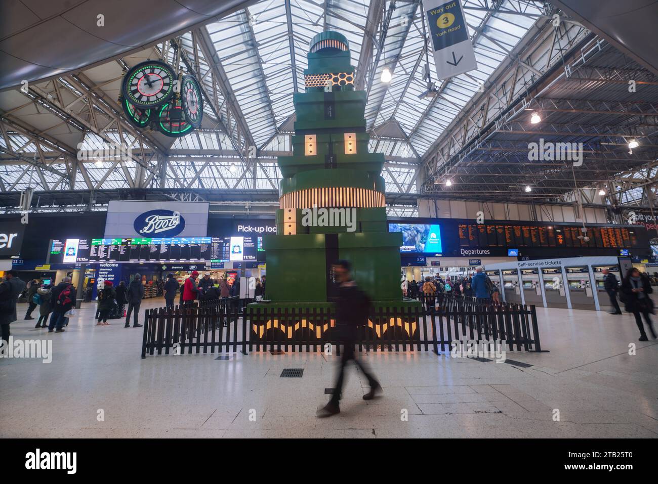 London UK. 4 December 2023. A 10-meter christmas tree shaped in green ...
