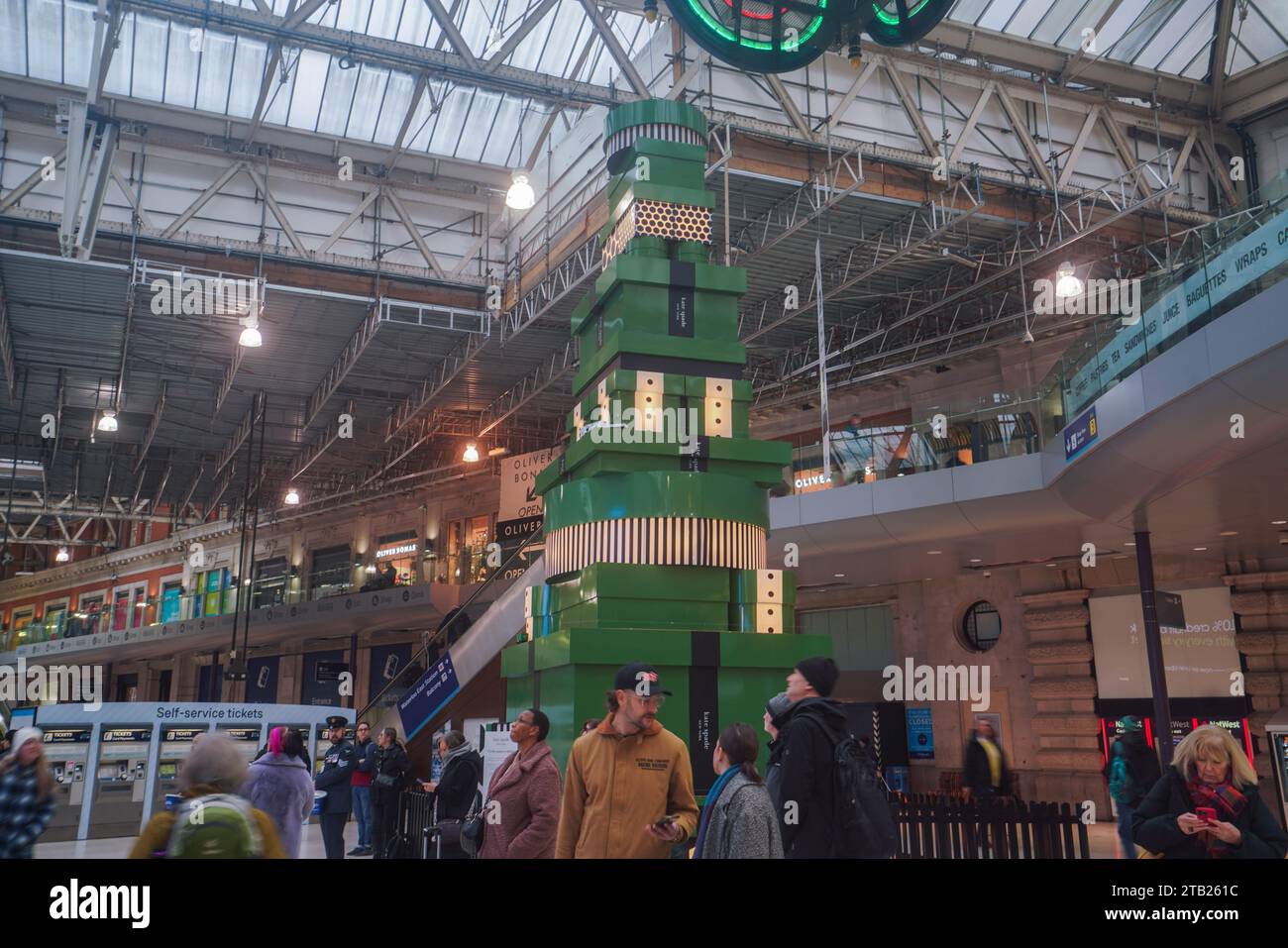 London UK. 4 December 2023. A 10-meter christmas tree shaped in green ...