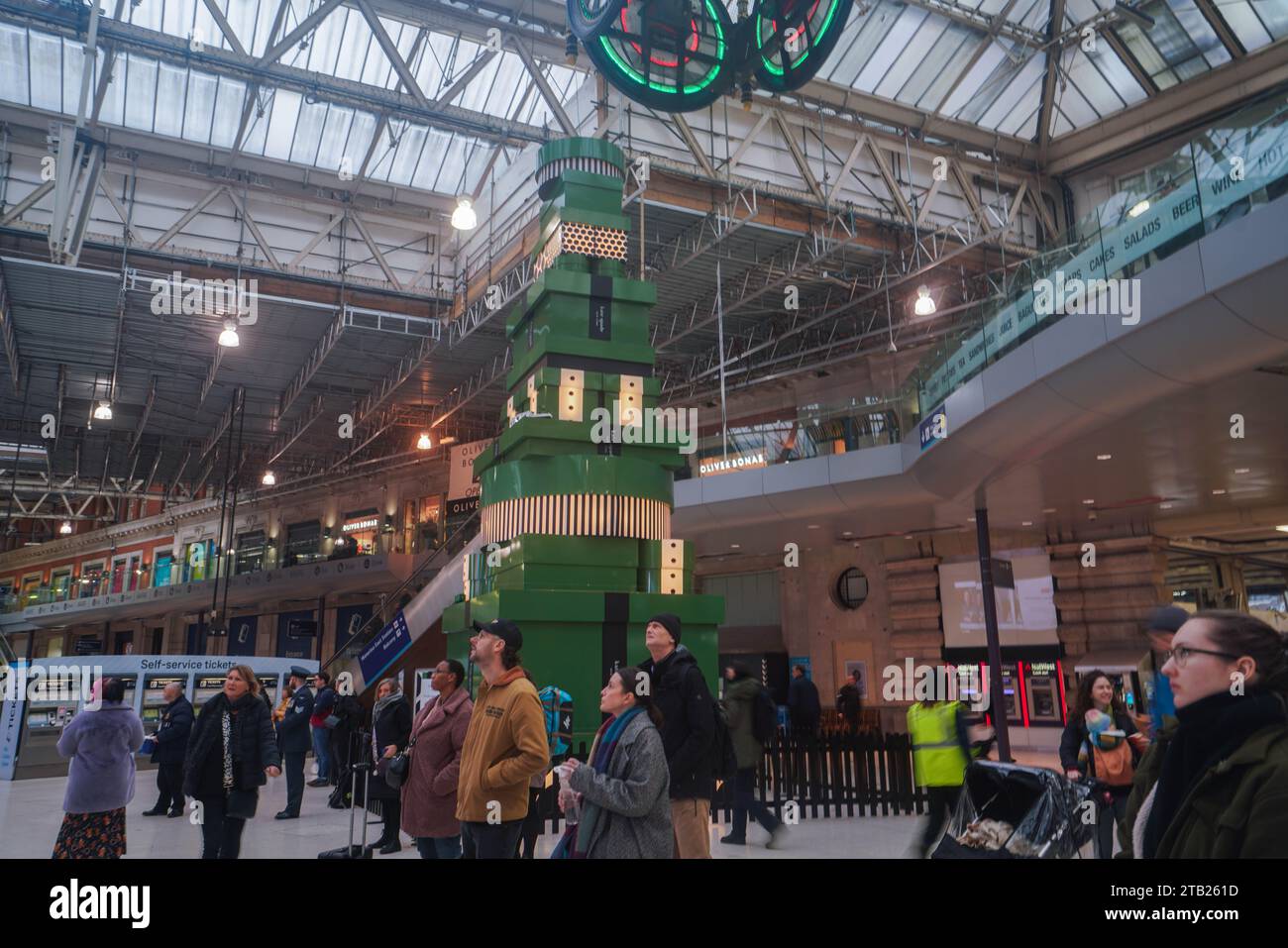 London UK. 4 December 2023. A 10-meter christmas tree shaped in green ...