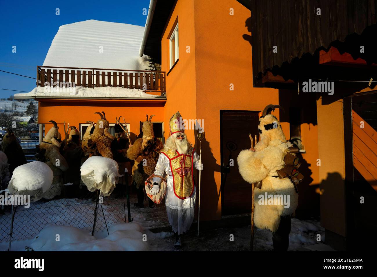 Revelers take part in a traditional St. Nicholas procession in the ...