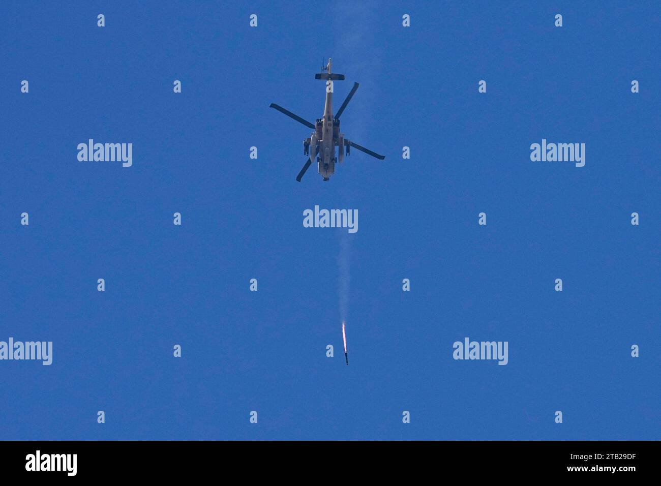 An Israeli Apache helicopter fires a missile in direction of the Gaza ...
