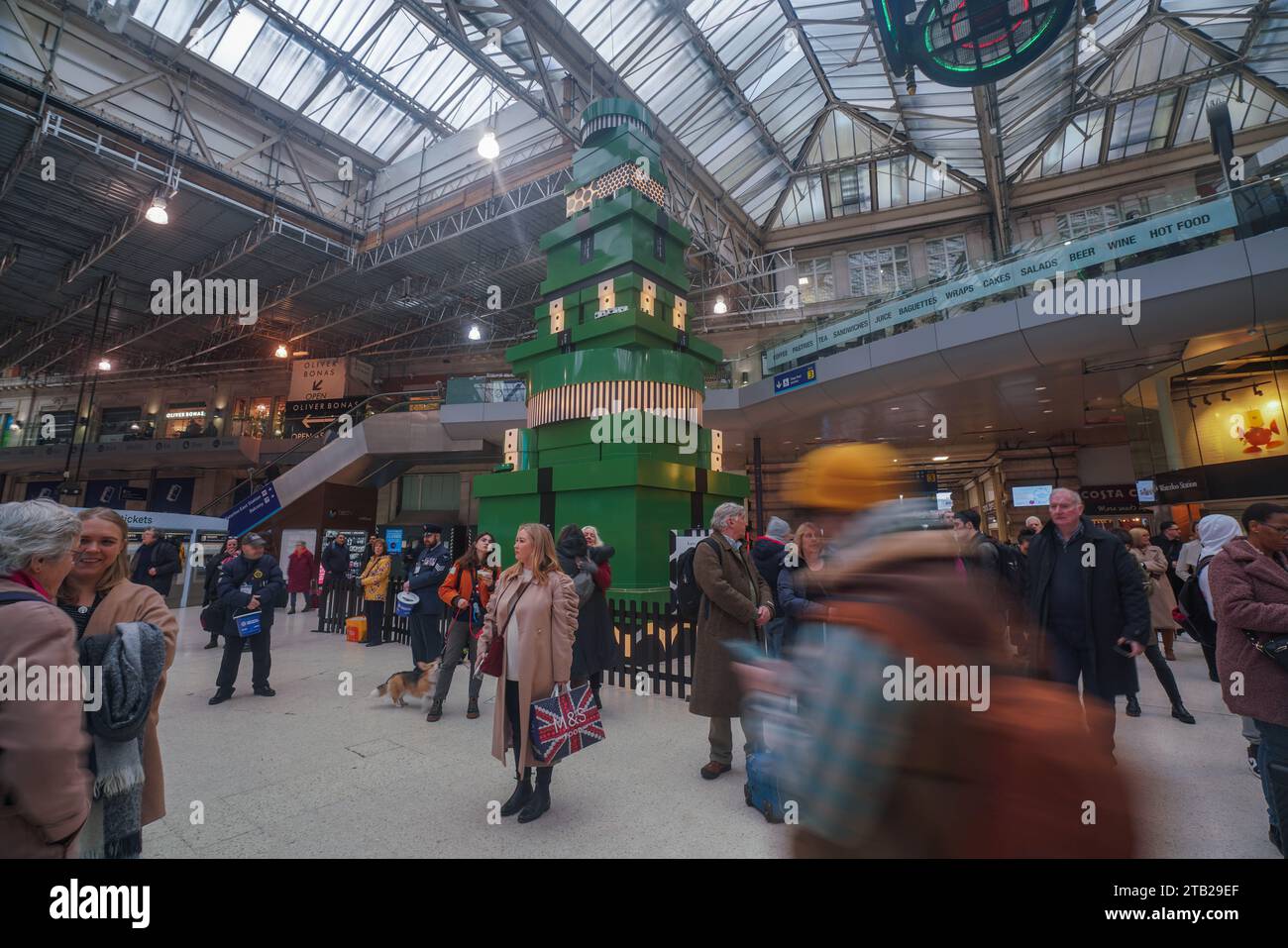 London UK. 4 December 2023. A 10-meter christmas tree shaped in green ...