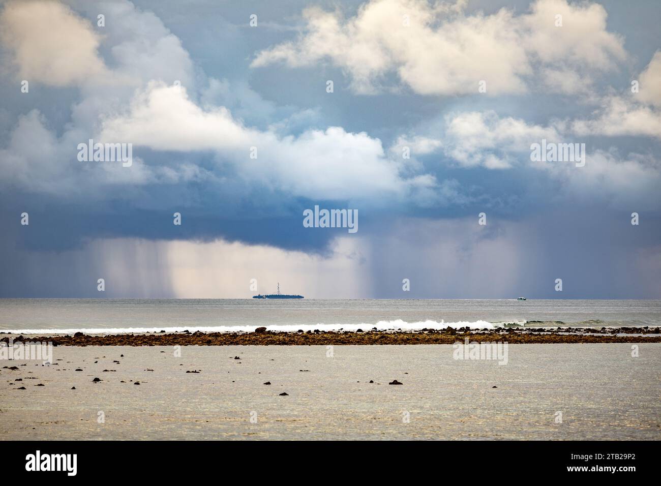 rain storm over tropical island and ocean Stock Photo - Alamy