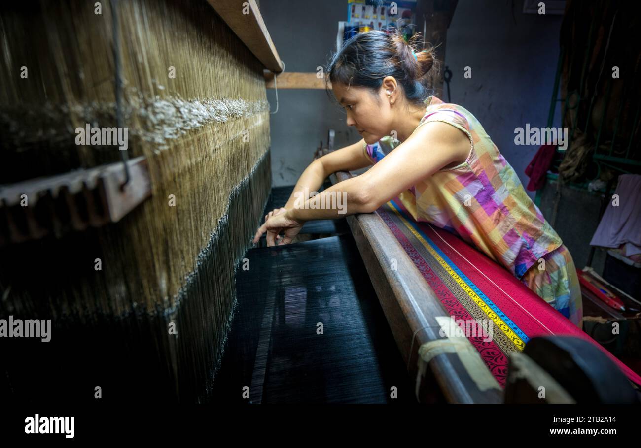 Hand weaving fabric using traditional technology on the outskirts of ...