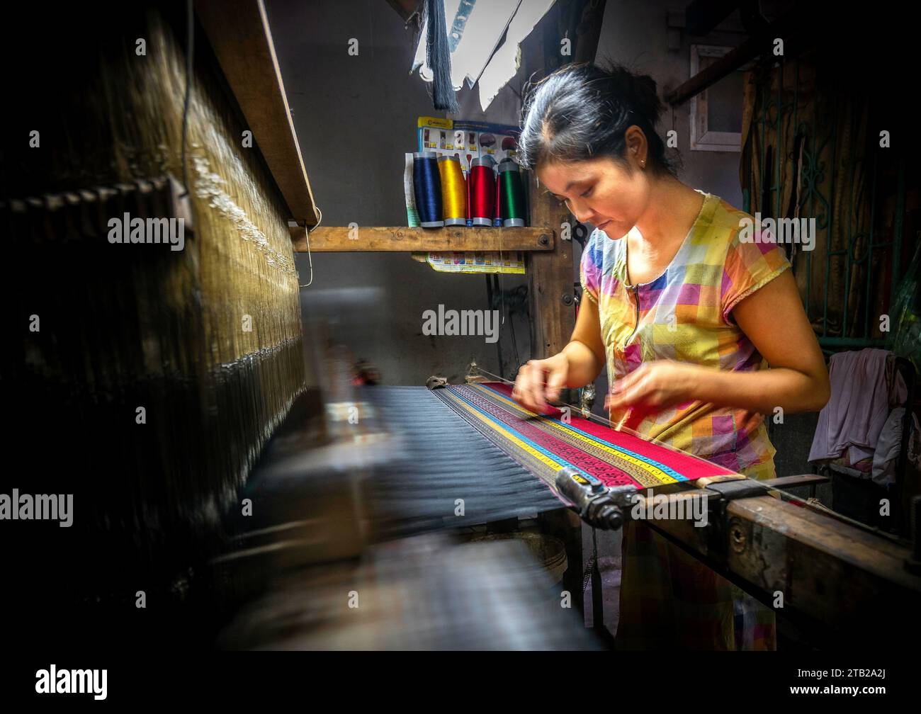 Hand weaving fabric using traditional technology on the outskirts of ...