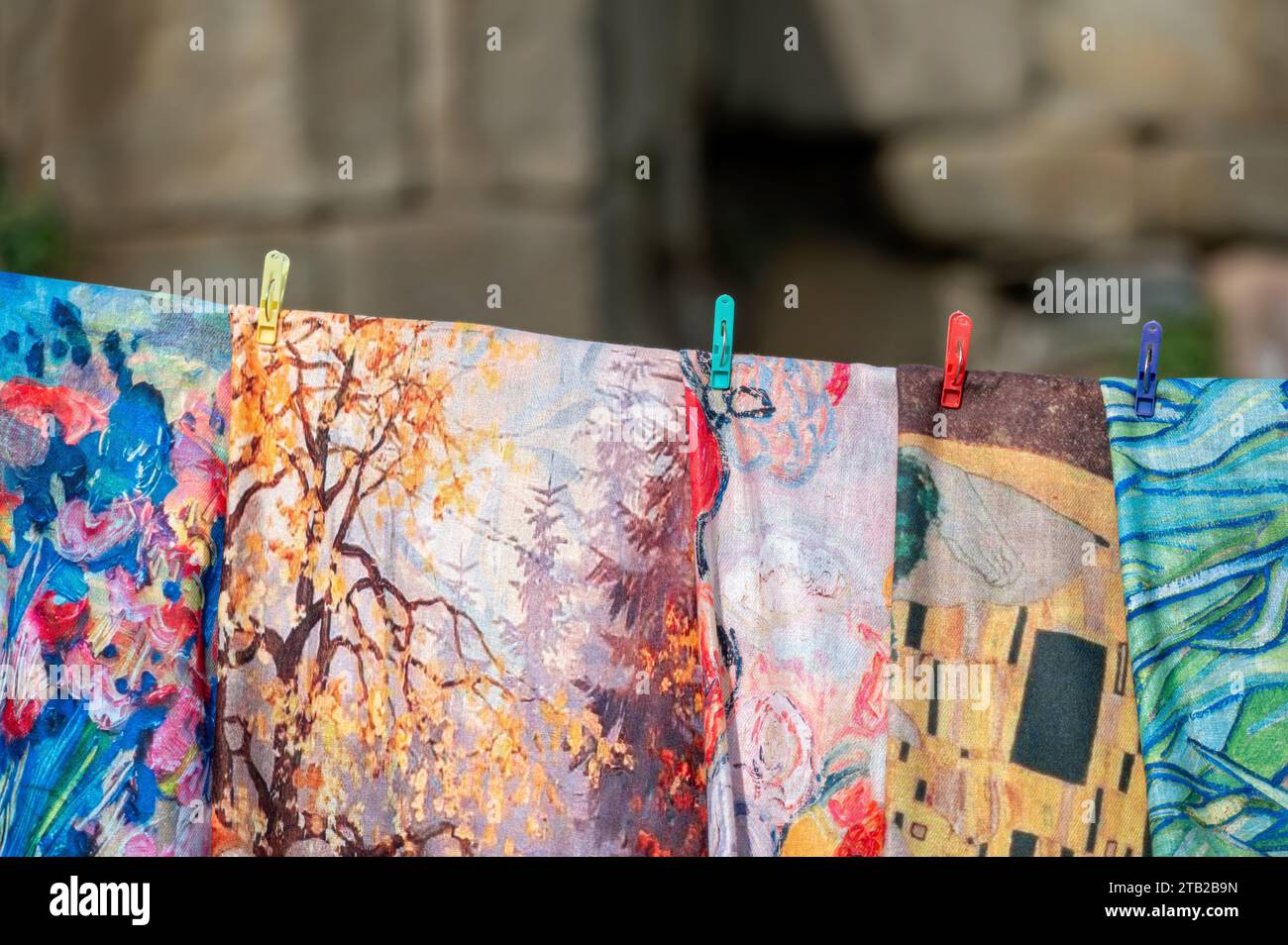 Colorful fabrics hanging on a clothesline in an outdoor market Stock ...