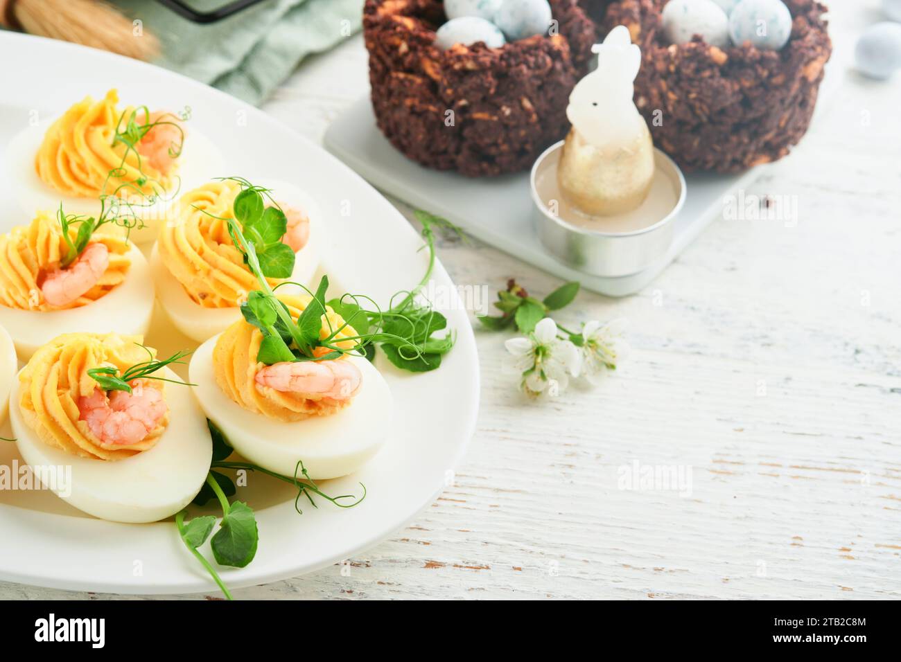 Stuffed or deviled eggs yolk, shrimp, pea microgreens with paprika for ...
