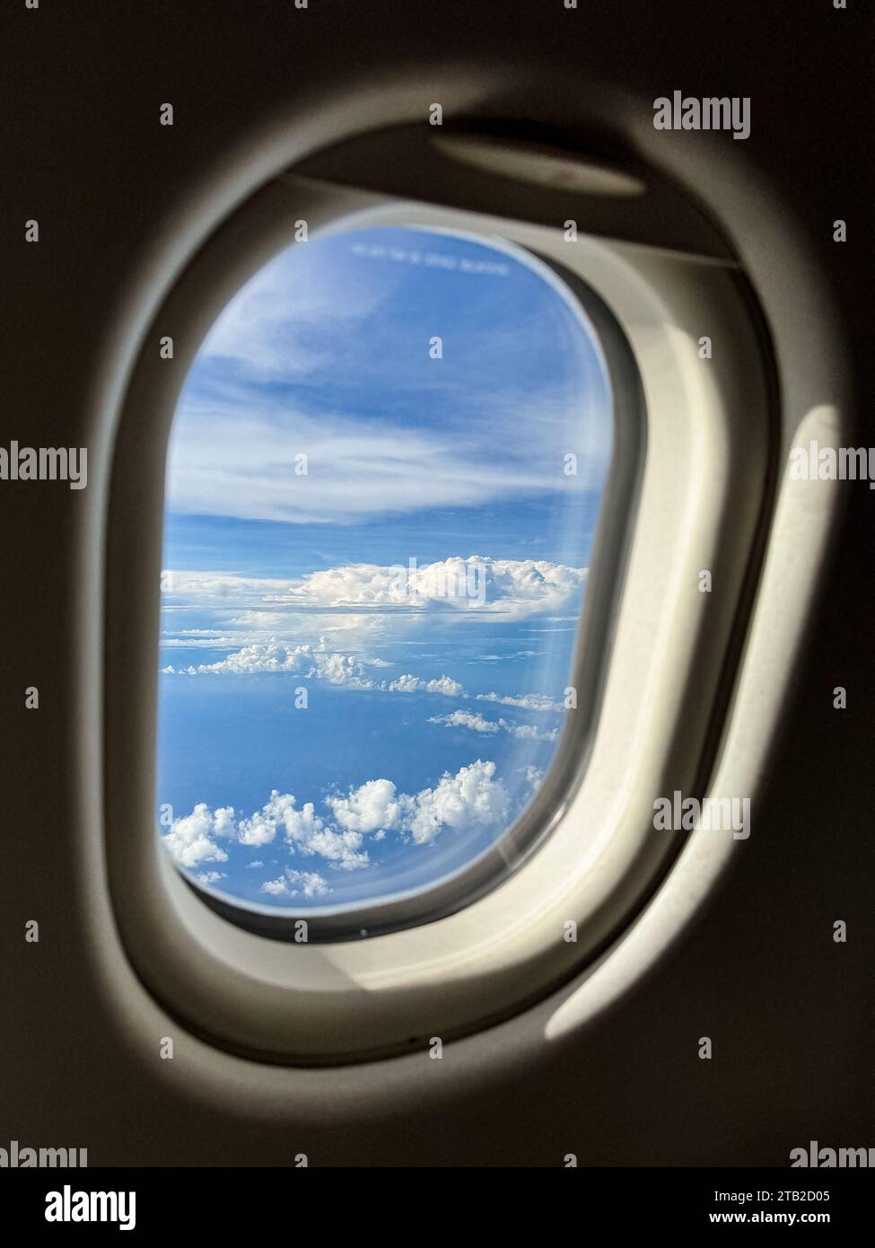 Tropical islands and blue water outside airplane window luxury travel ...