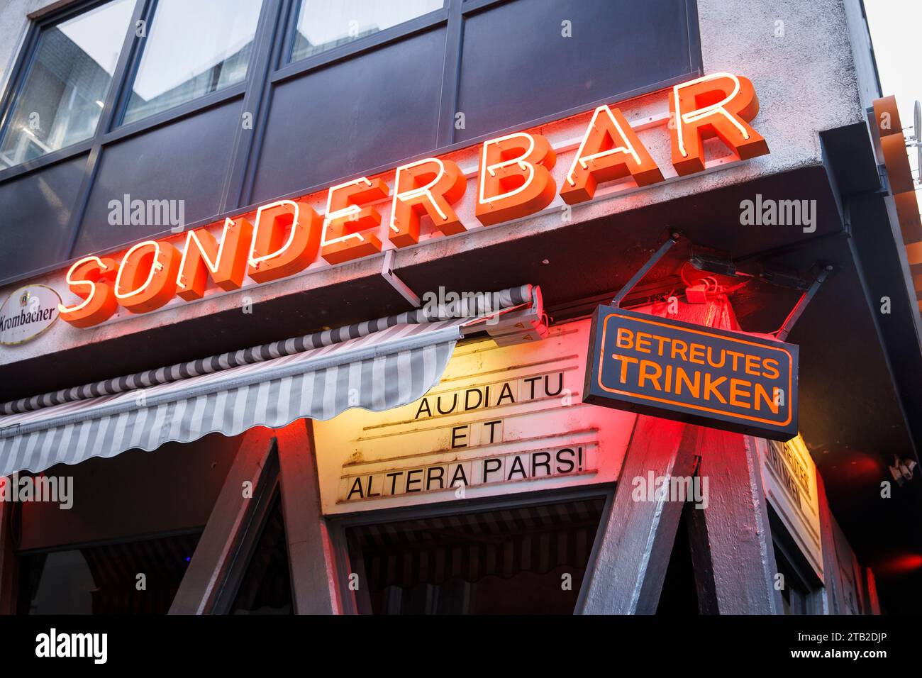 slogans on a pub in the old town, supervised drinking and audiatur et ...